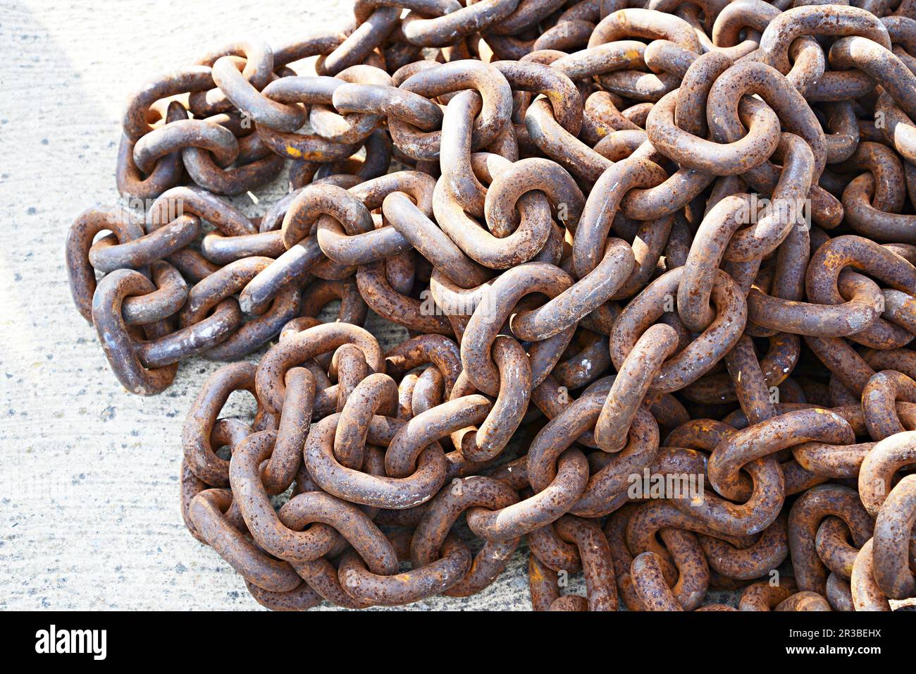 Rusty metal chain on concrete hi-res stock photography and images - Alamy