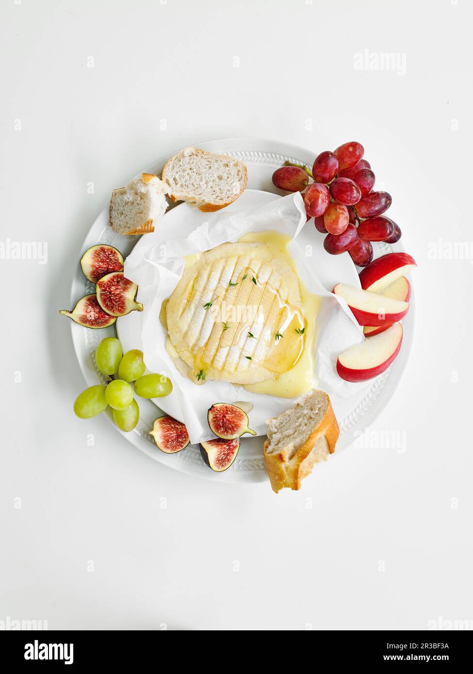 Whole baked brie Stock Photo - Alamy