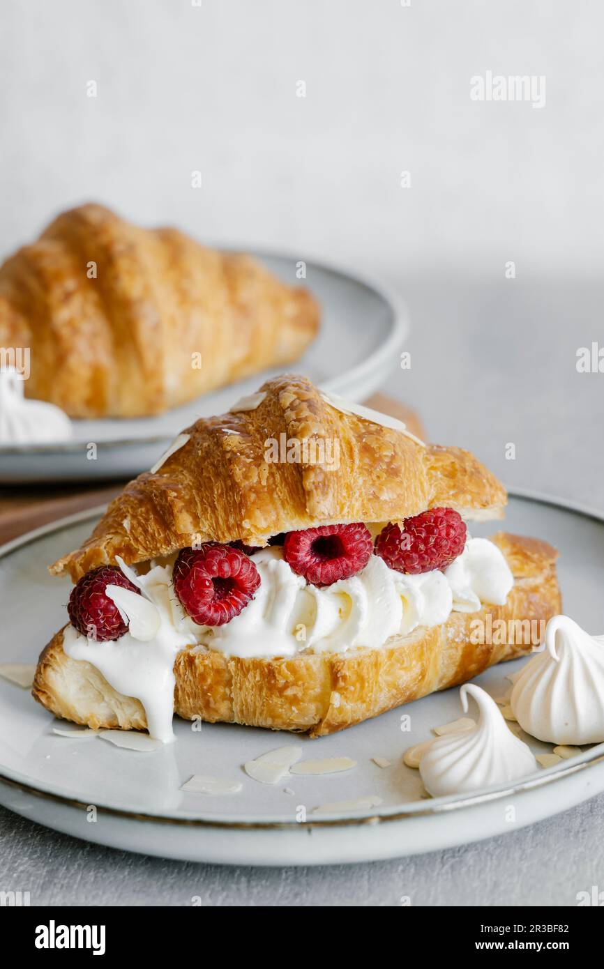 Vanilla cream and fresh raspberry croissant Stock Photo - Alamy