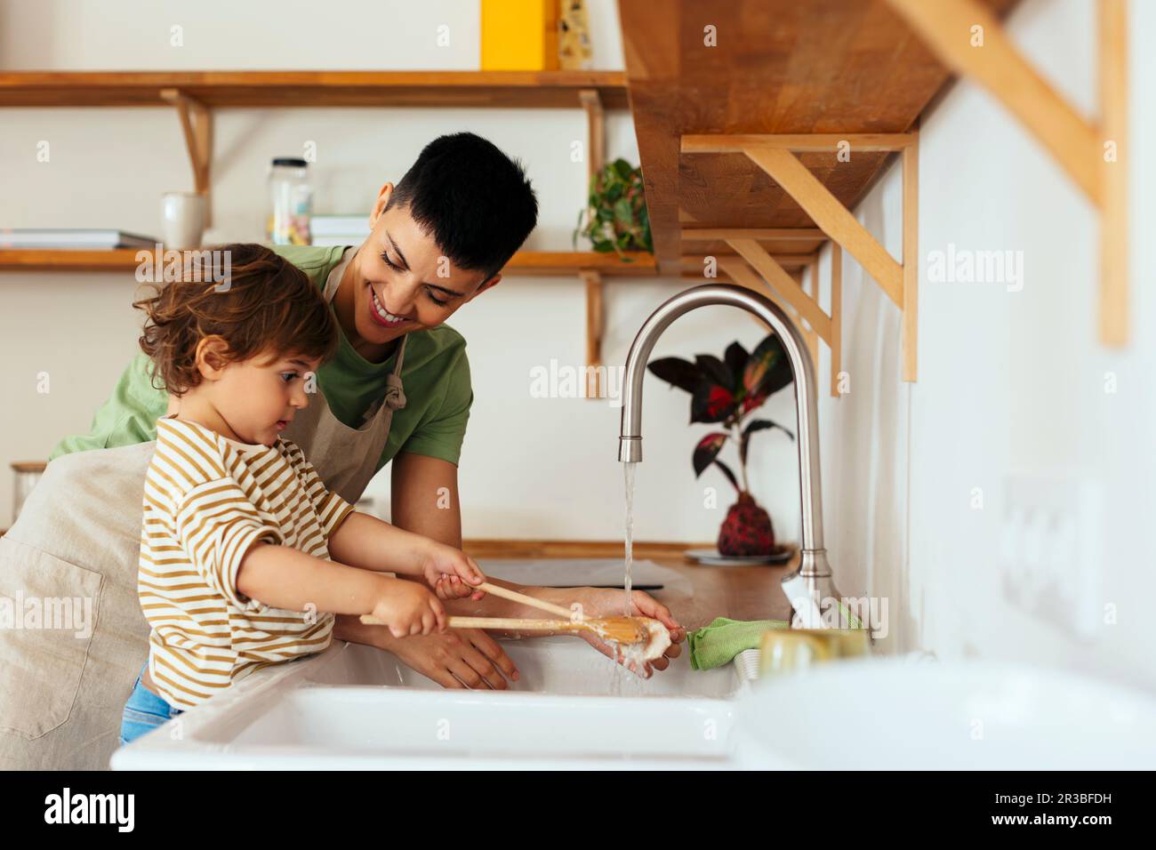 Mother washing adult son hi-res stock photography and images - Alamy