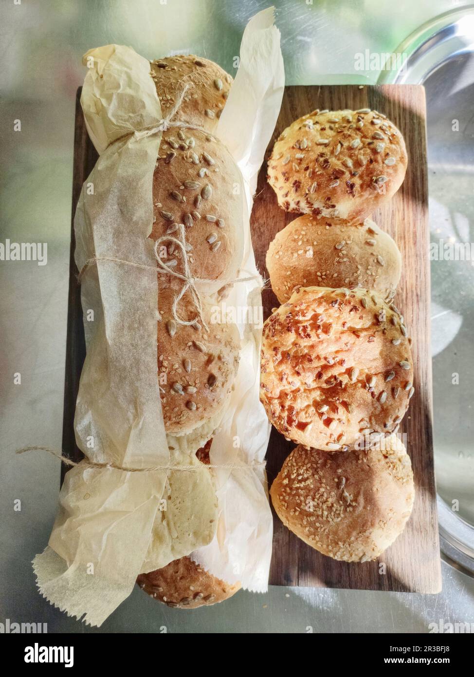 Bread roll with sesame seeds and sunflower seeds Stock Photo - Alamy
