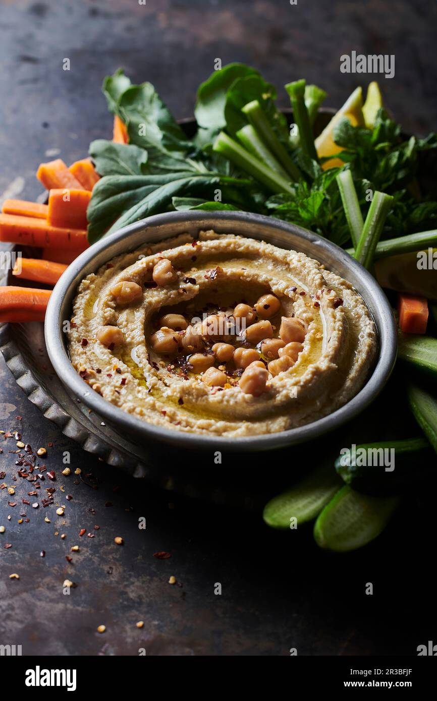 Chickpea cream with vegetable sticks Stock Photo - Alamy