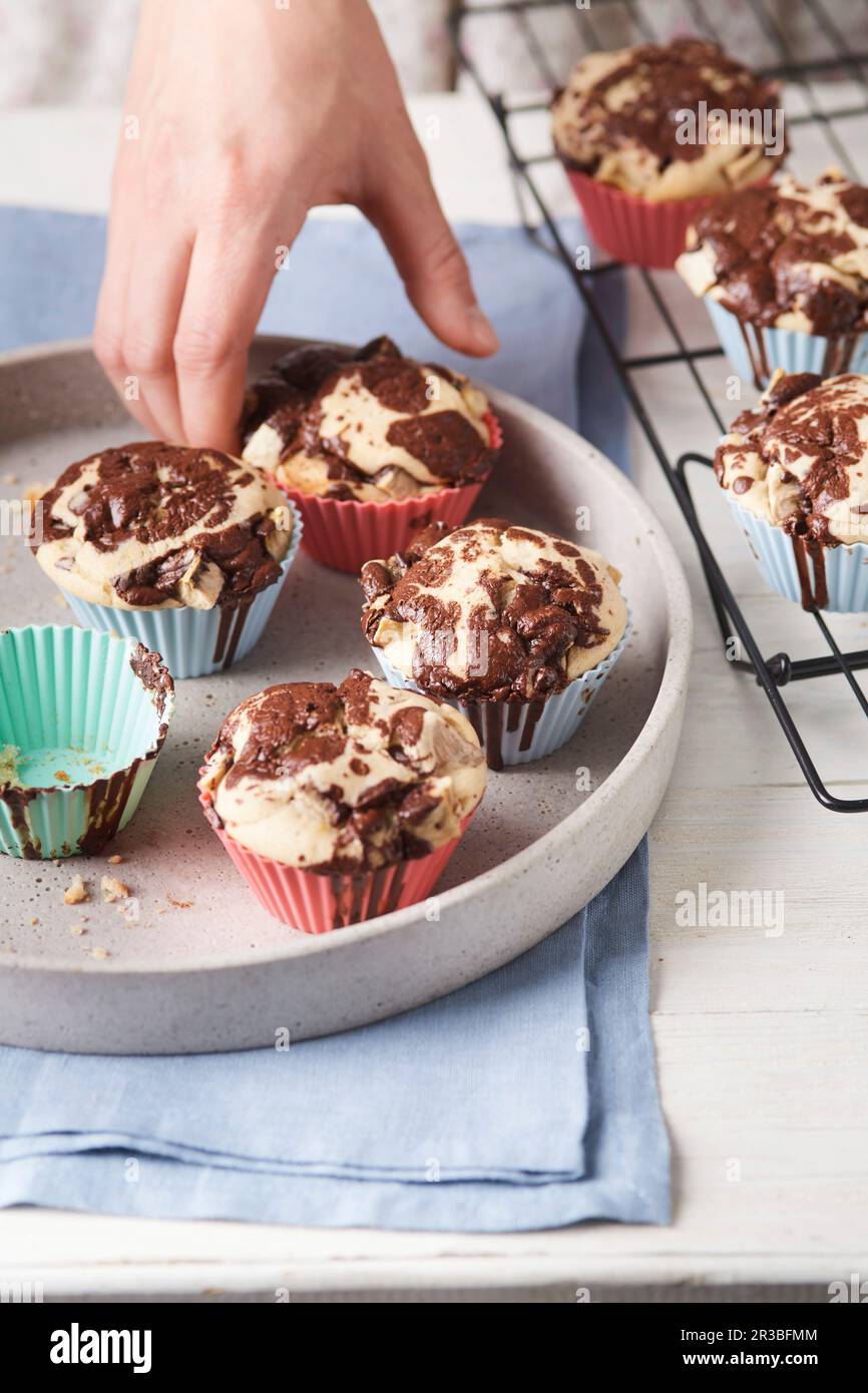 Hand take one cup cake hi-res stock photography and images - Alamy