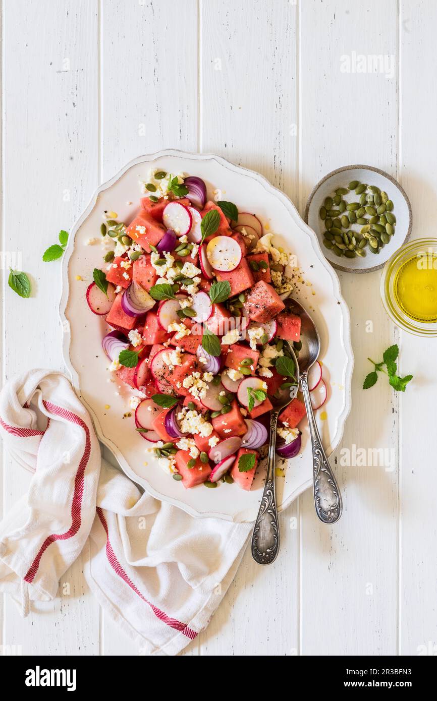 Watermelon, radish, feta, red onion and pepita seed salad Stock Photo ...
