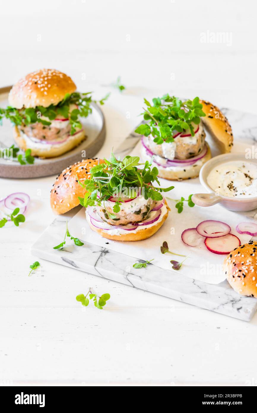Chicken patty burgers with red onion, radish, microgreen mustard and ...