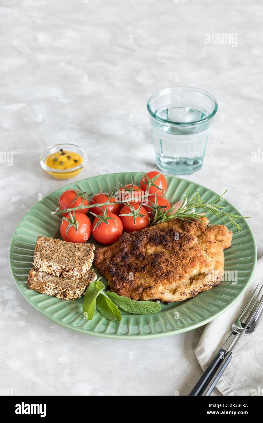 Breaded pork schnitzel Stock Photo - Alamy