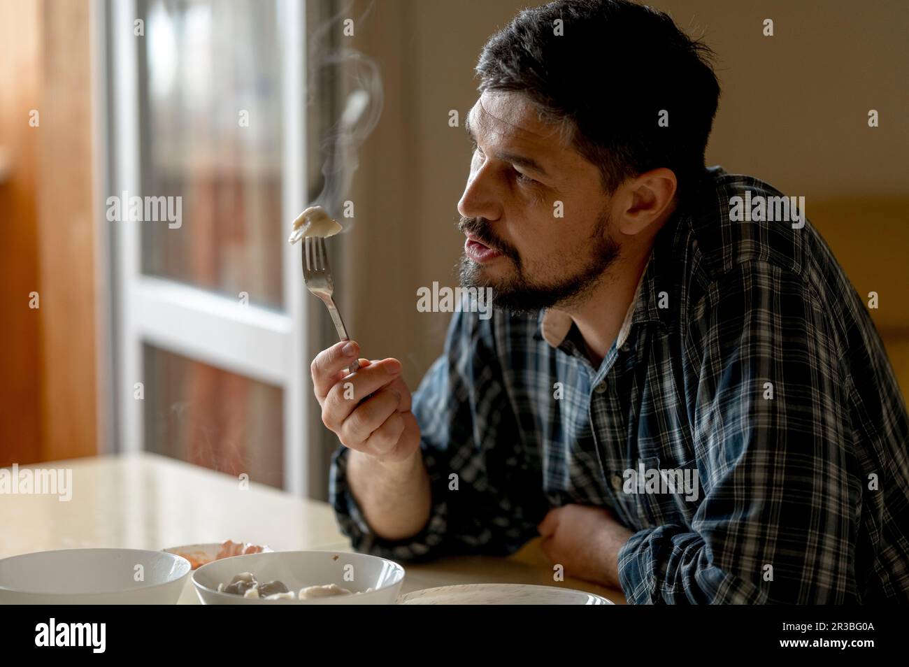 Man eating fork hi-res stock photography and images - Alamy