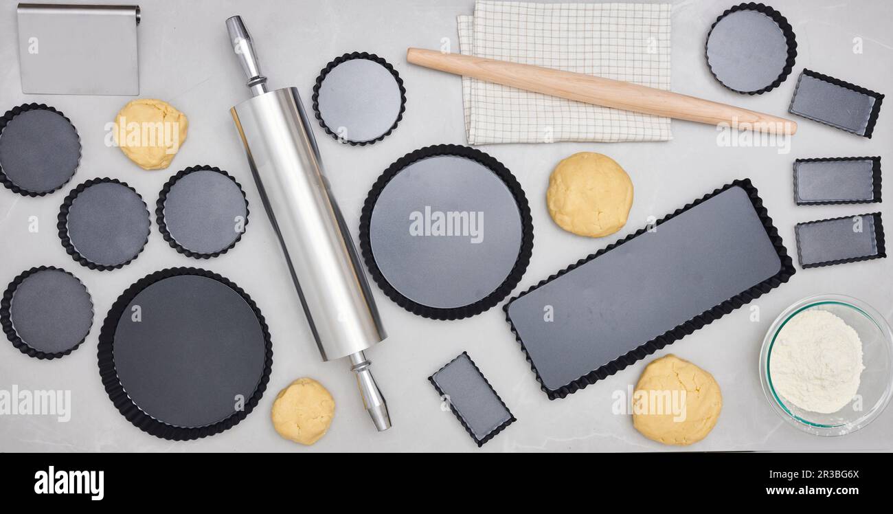 Various tart and pie shapes with a rolling pin Stock Photo - Alamy
