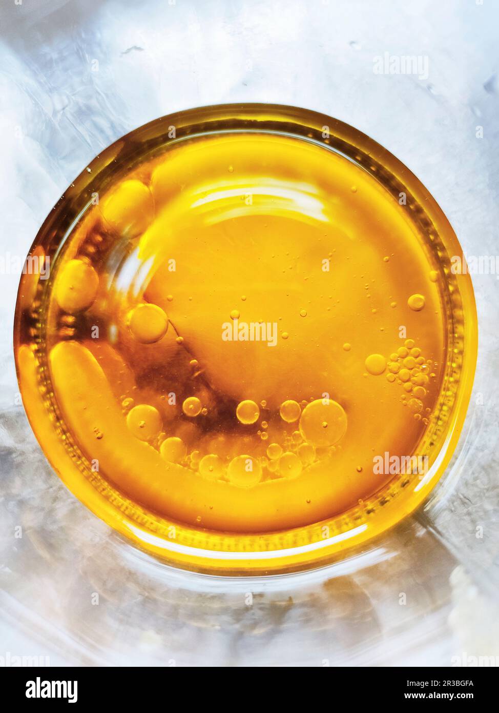 Mixture of oil and vinegar in a glass (top view Stock Photo - Alamy
