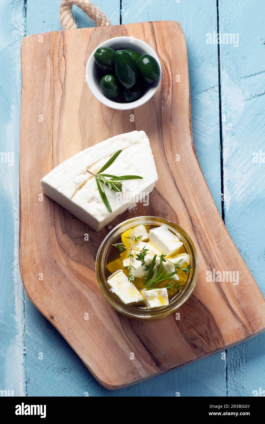 Feta cheese, olives and marinated feta in olive oil Stock Photo - Alamy
