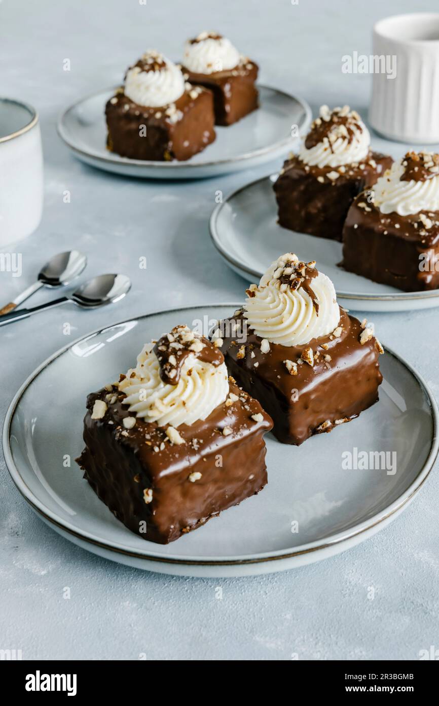 Chocolate individual mini cakes with cream cheese and nuts Stock Photo ...