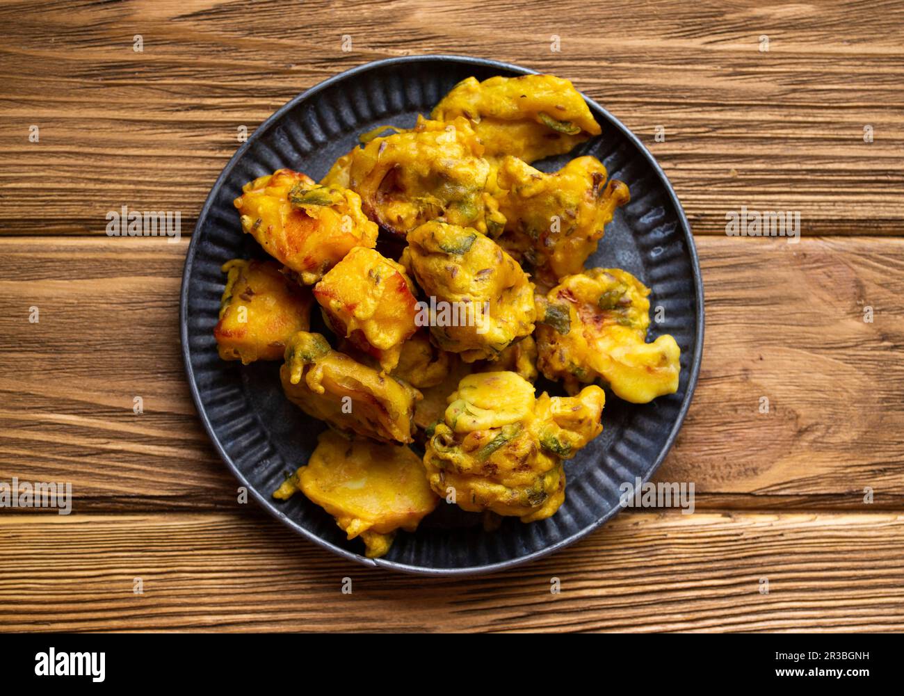 Indian fried assorted pakoras on wooden rustic background Stock Photo ...