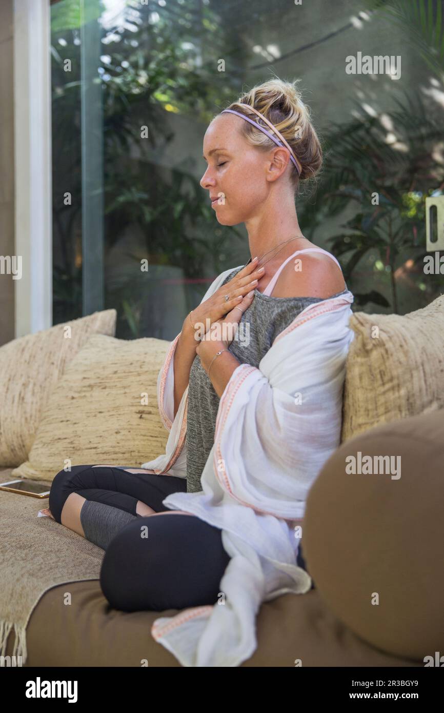 Woman sitting on chest hi-res stock photography and images - Alamy