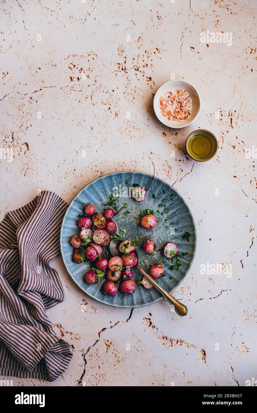 Roasted radishes with pink salt and olive oil Stock Photo - Alamy