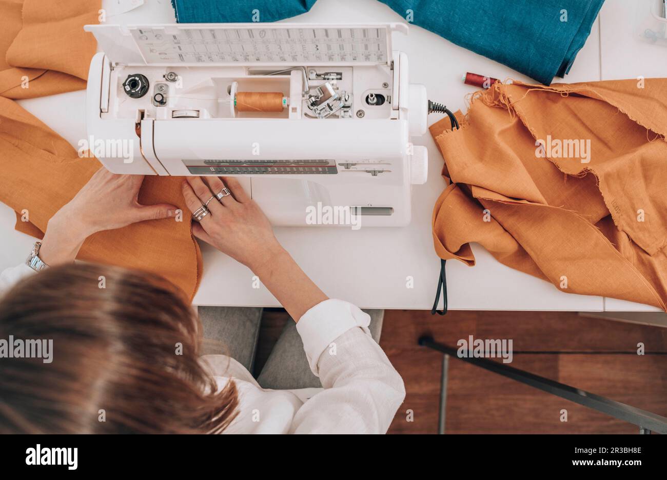 Seamstress working sewing machine hi-res stock photography and images ...