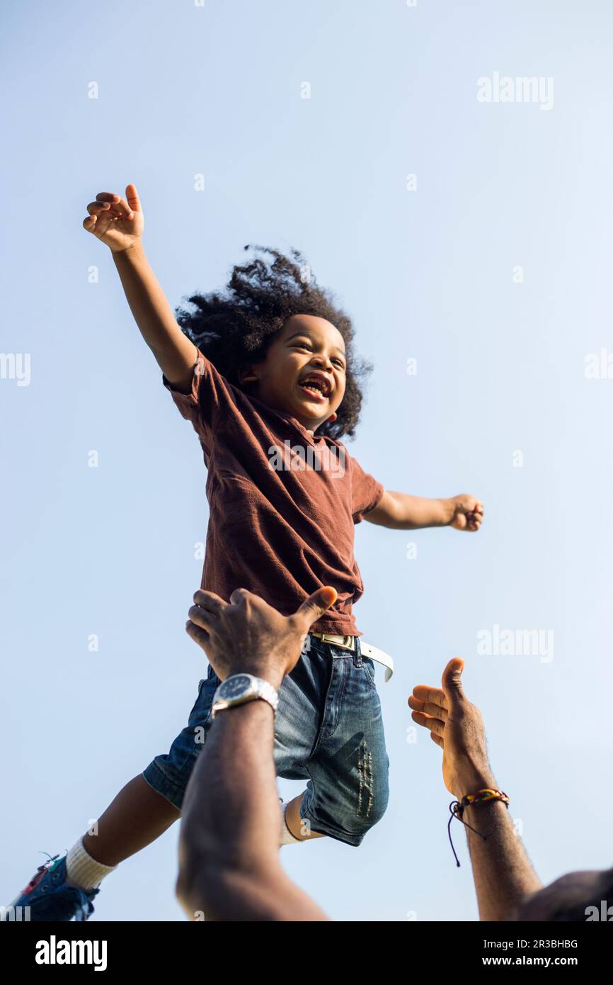 Man throwing child air catching hi-res stock photography and images - Alamy