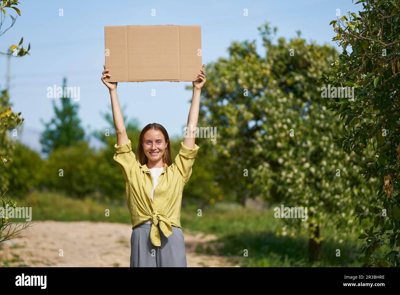 Woman holding arms out hi-res stock photography and images - Alamy