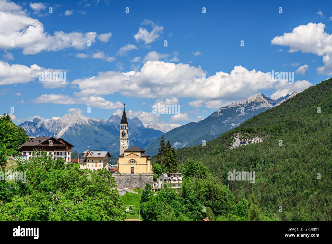Italy, Veneto, Cibiana di Cadore, Summer clouds over village in ...