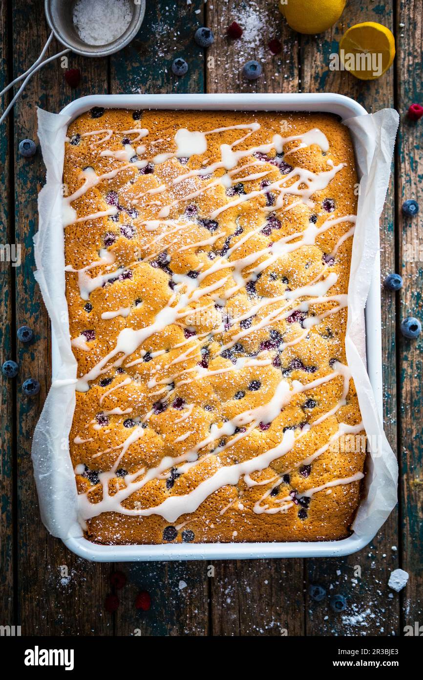Blueberry tray bake cake with lemon glaze Stock Photo - Alamy