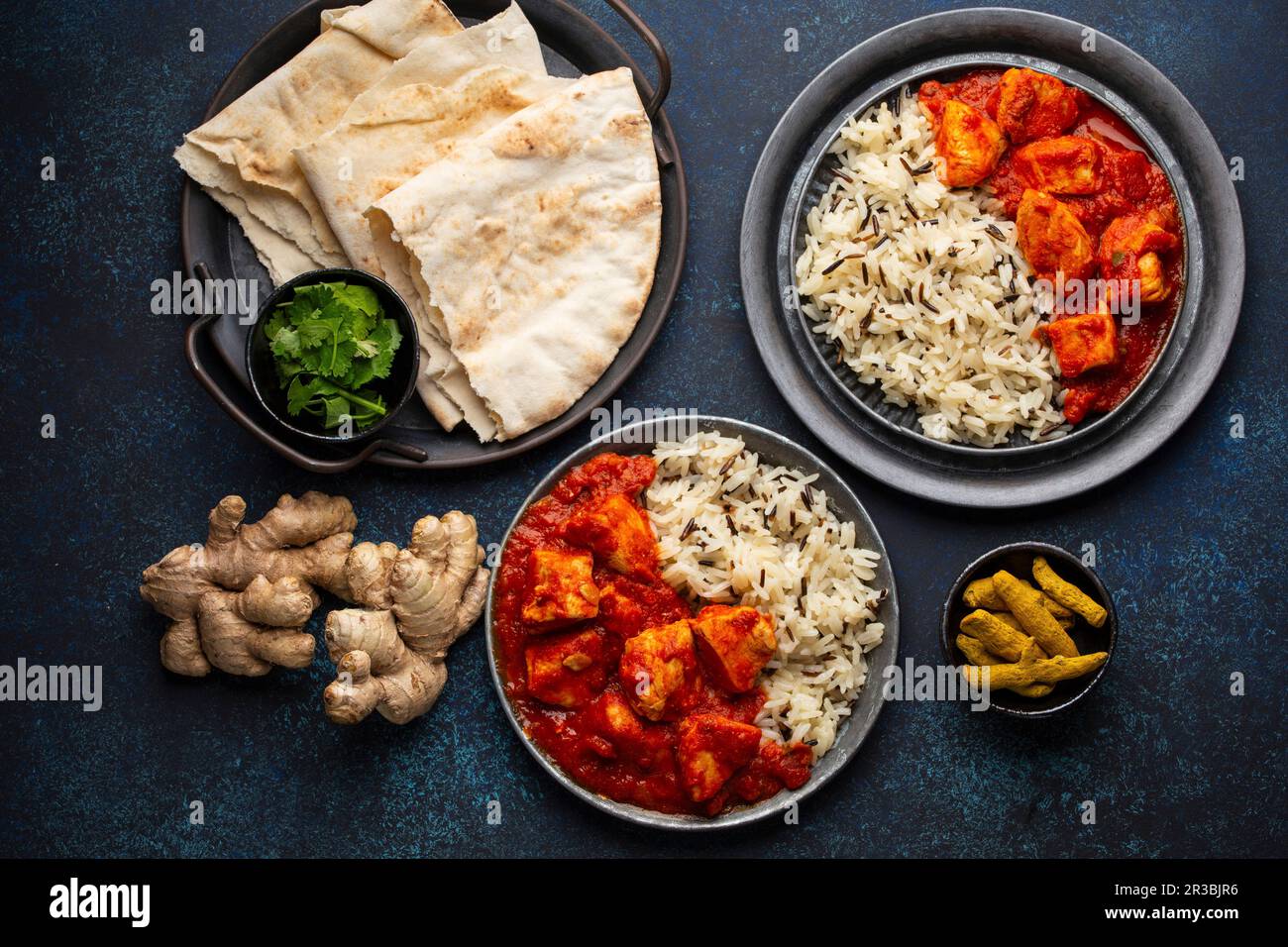 Indian chicken tikka masala dish with rice Stock Photo - Alamy