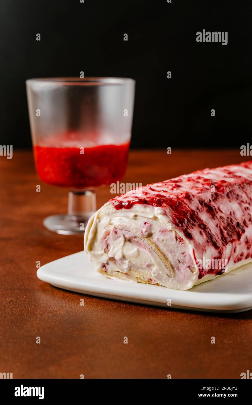 Vanilla cream cheese raspberry swiss roll cake Stock Photo - Alamy