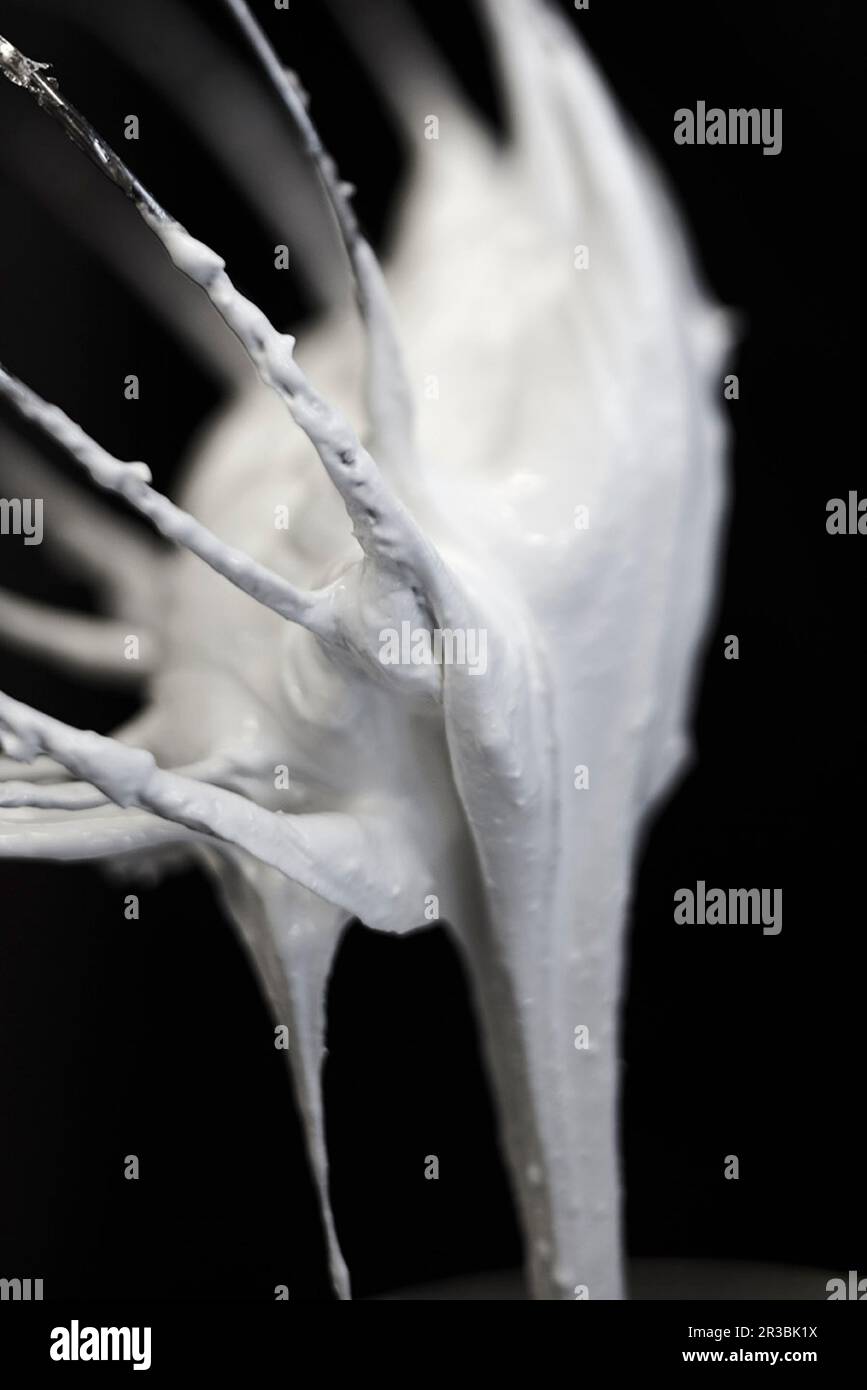 Whipped macaroon mixture on a whisk Stock Photo - Alamy