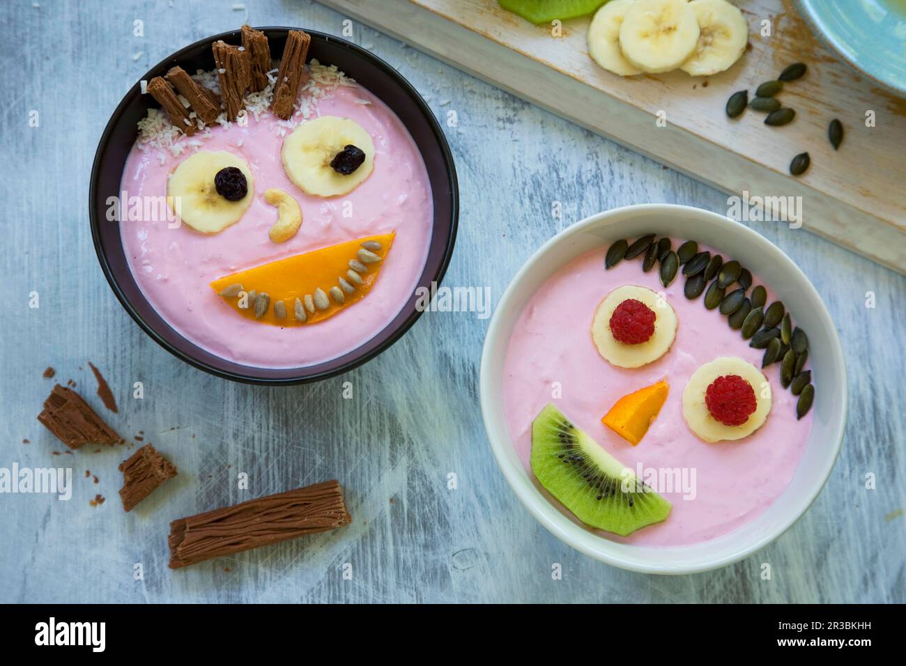 Smiley yoghurt faces Stock Photo - Alamy
