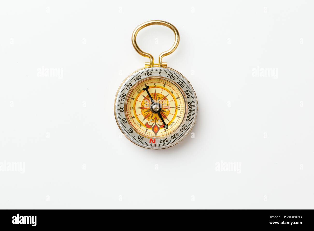Antique golden compass isolated on white background Stock Photo - Alamy