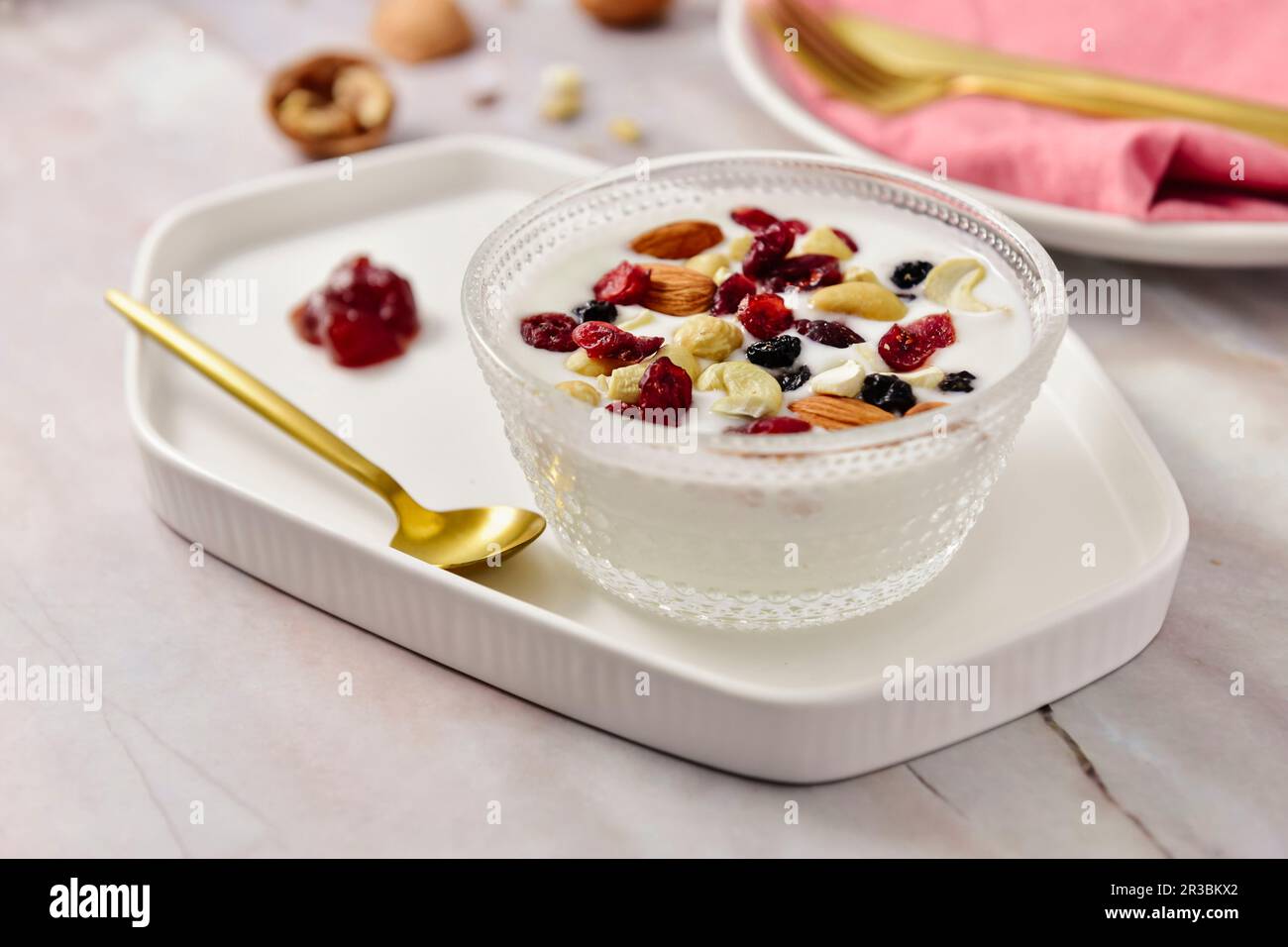 Yogurt with nuts topping Stock Photo - Alamy
