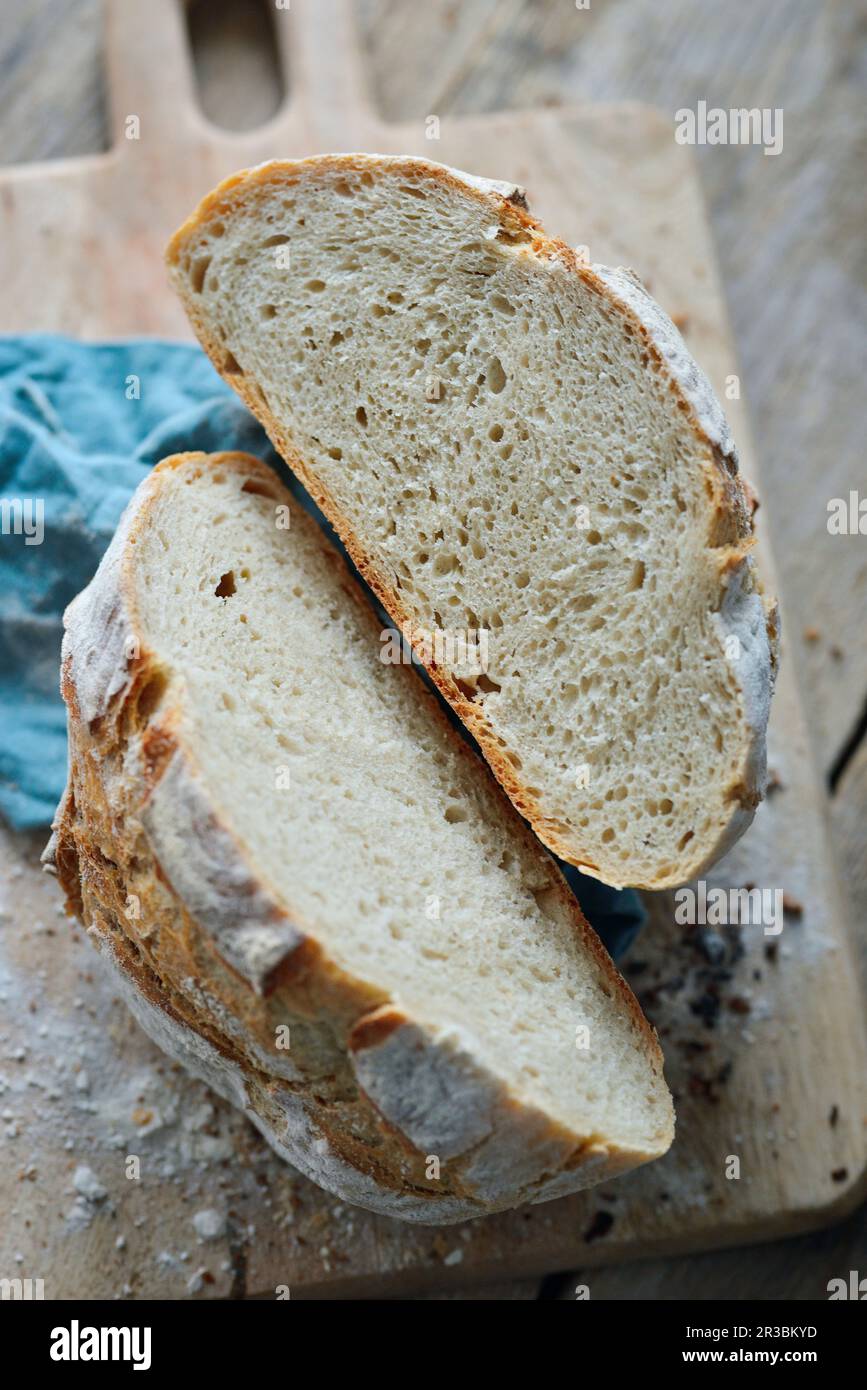 A loaf of bread, cut in half Stock Photo - Alamy
