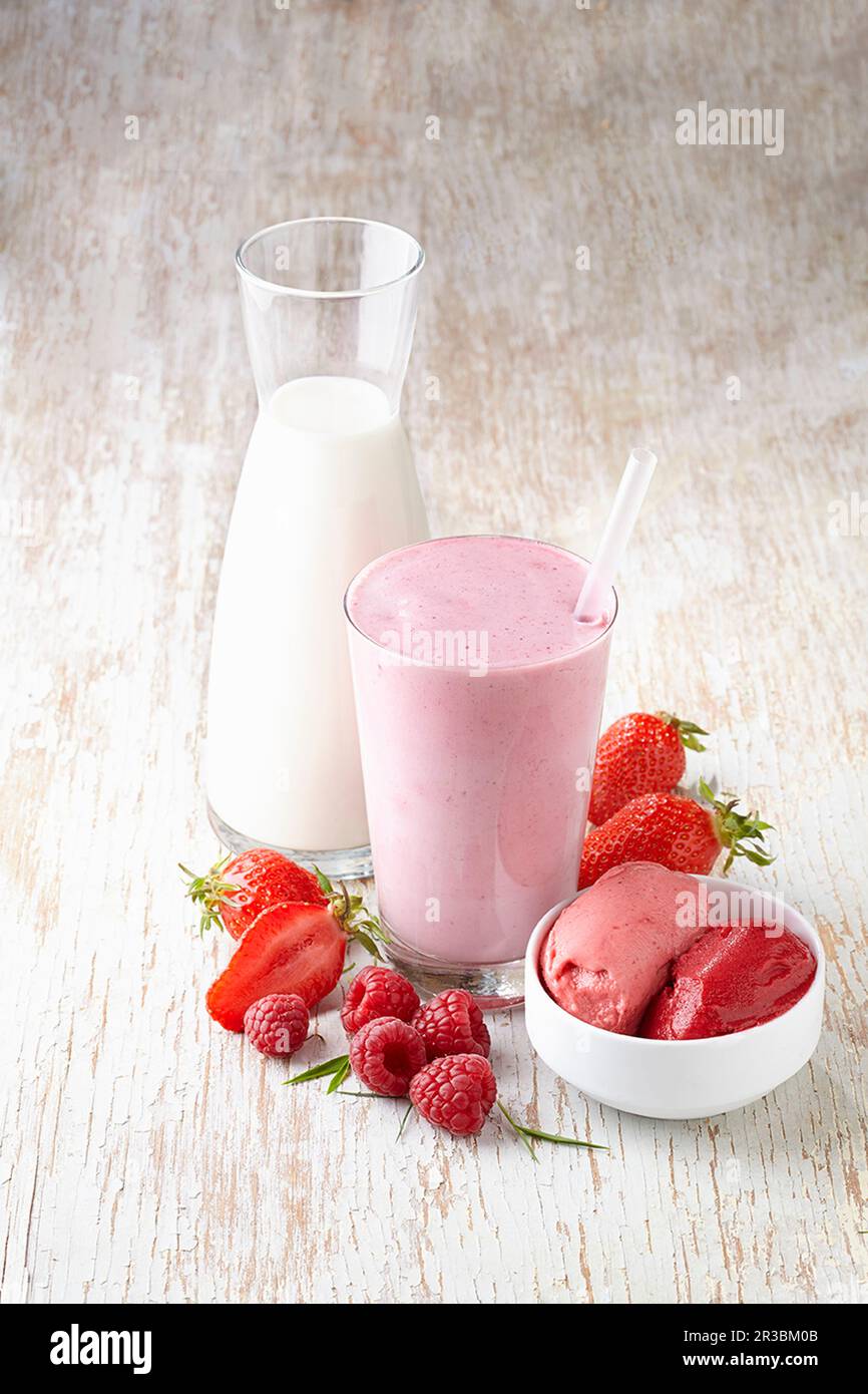 A strawberry milkshake and strawberry-and-raspberry sorbet Stock Photo ...
