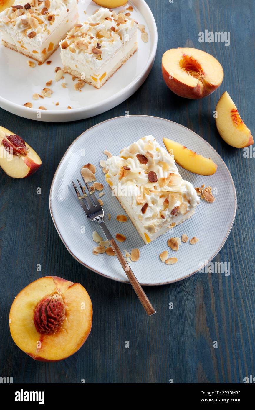 Creamy pie with peach pieces and almonds Stock Photo - Alamy