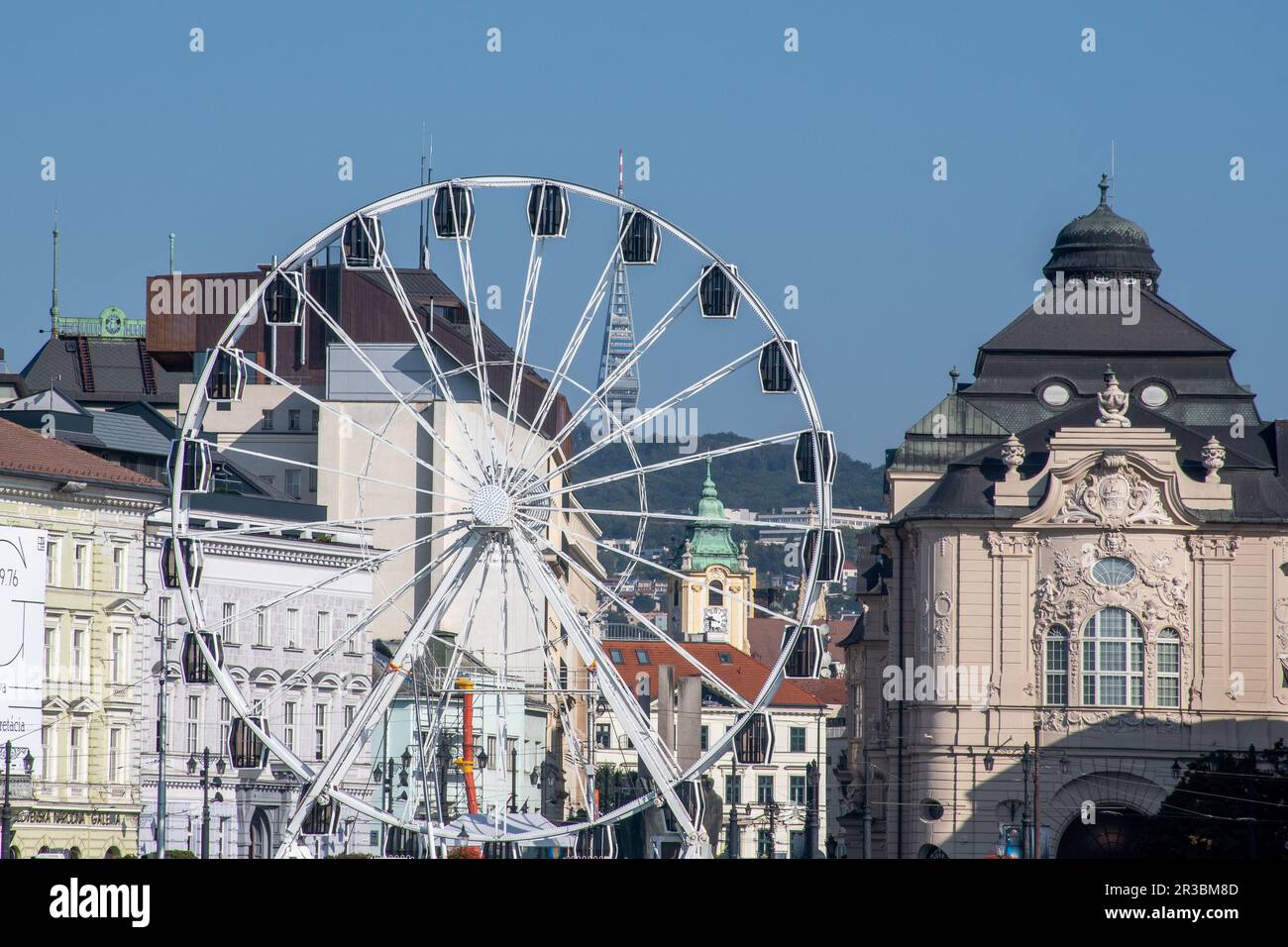 Bratislava Ferris wheel with reduta concert hall Stock Photo - Alamy