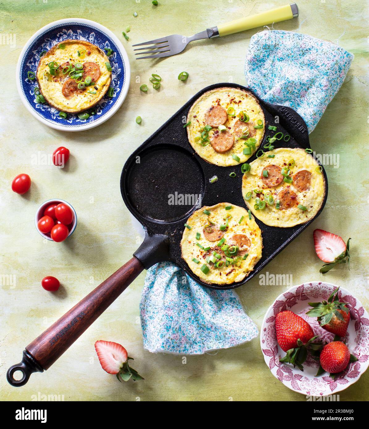Mini omelettes with sausages in omelet pan Stock Photo - Alamy