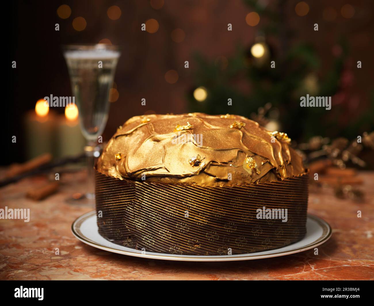 Panettone with golden glaze Stock Photo - Alamy