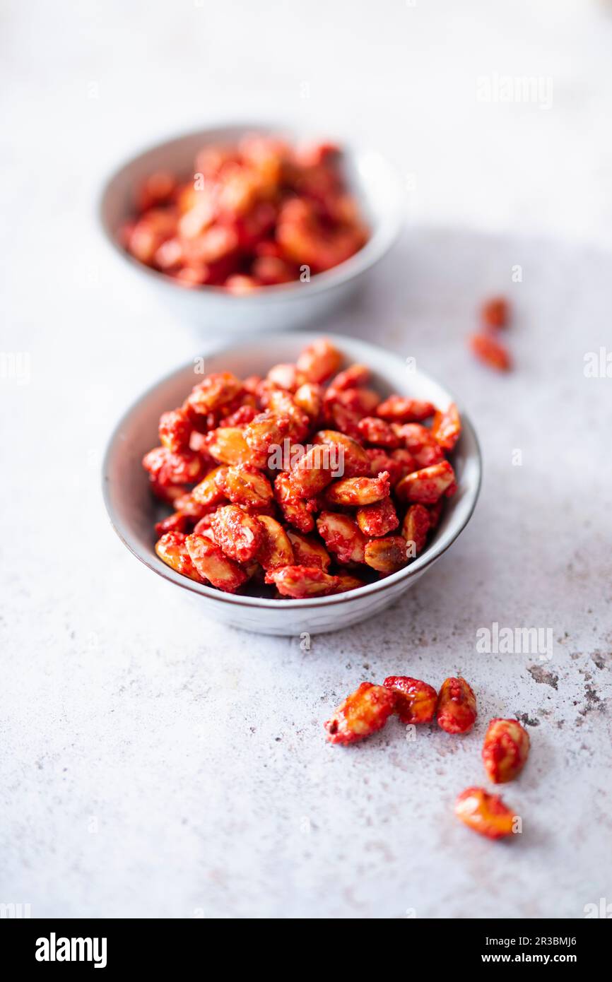 Roasted red almonds from France Stock Photo - Alamy