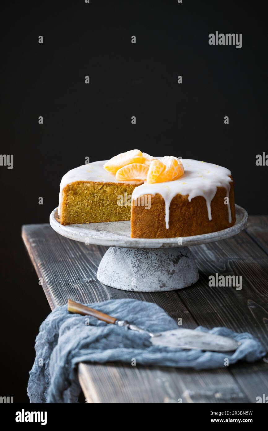 Mandarin cake with icing, sliced Stock Photo - Alamy