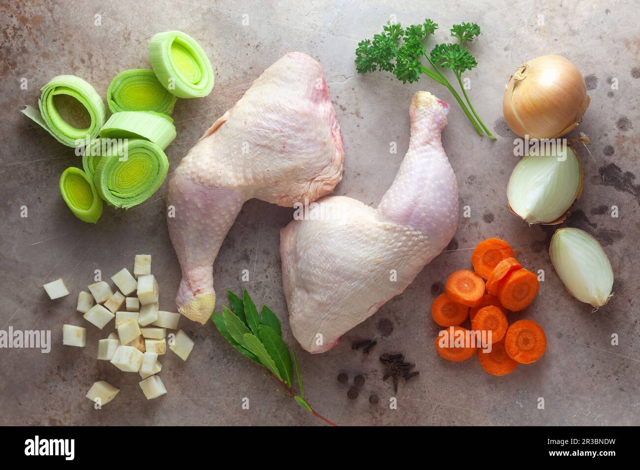 Chicken on herbs and vegetable step by step hi-res stock photography ...
