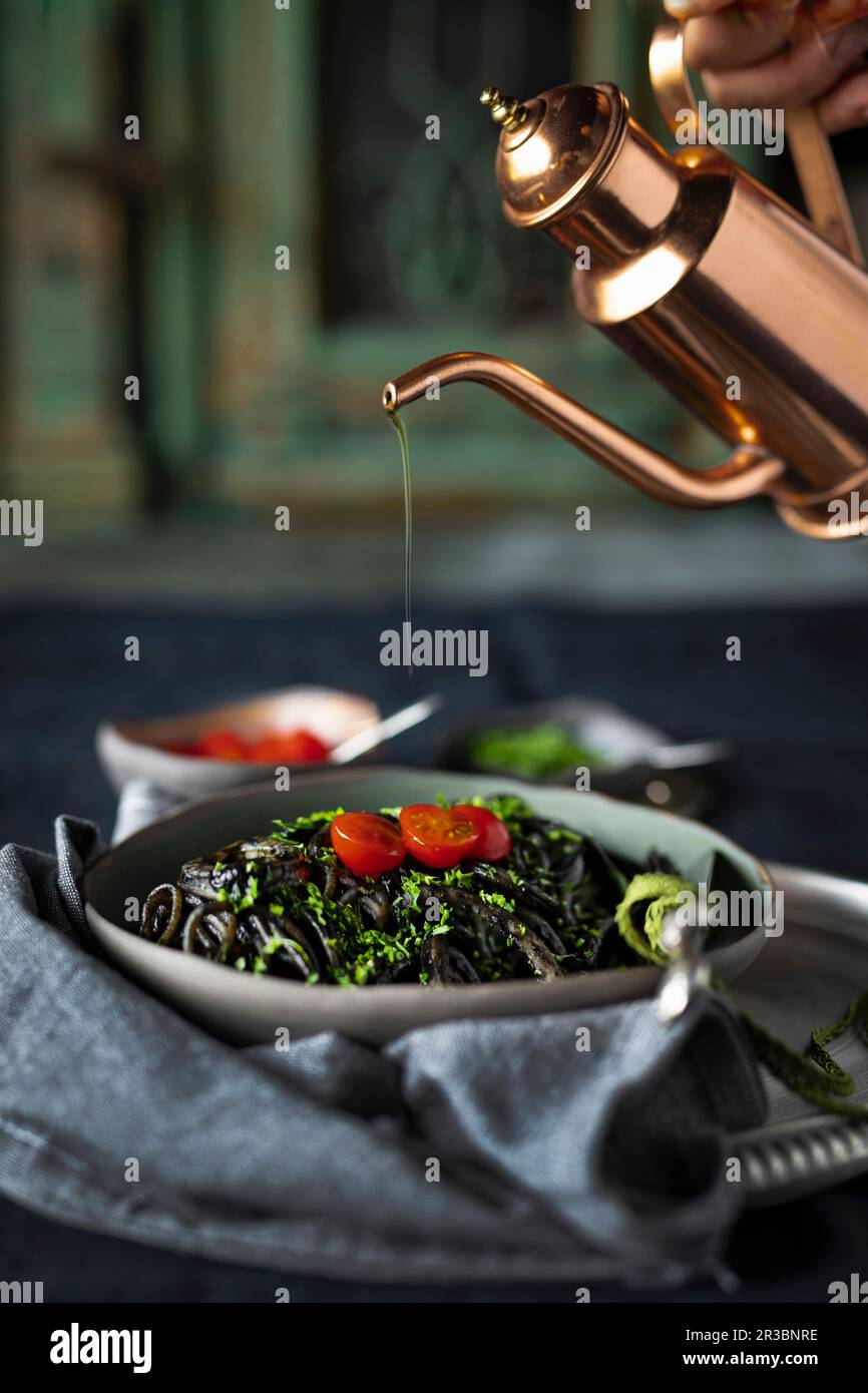 Black tagliatelle pasta Stock Photo - Alamy