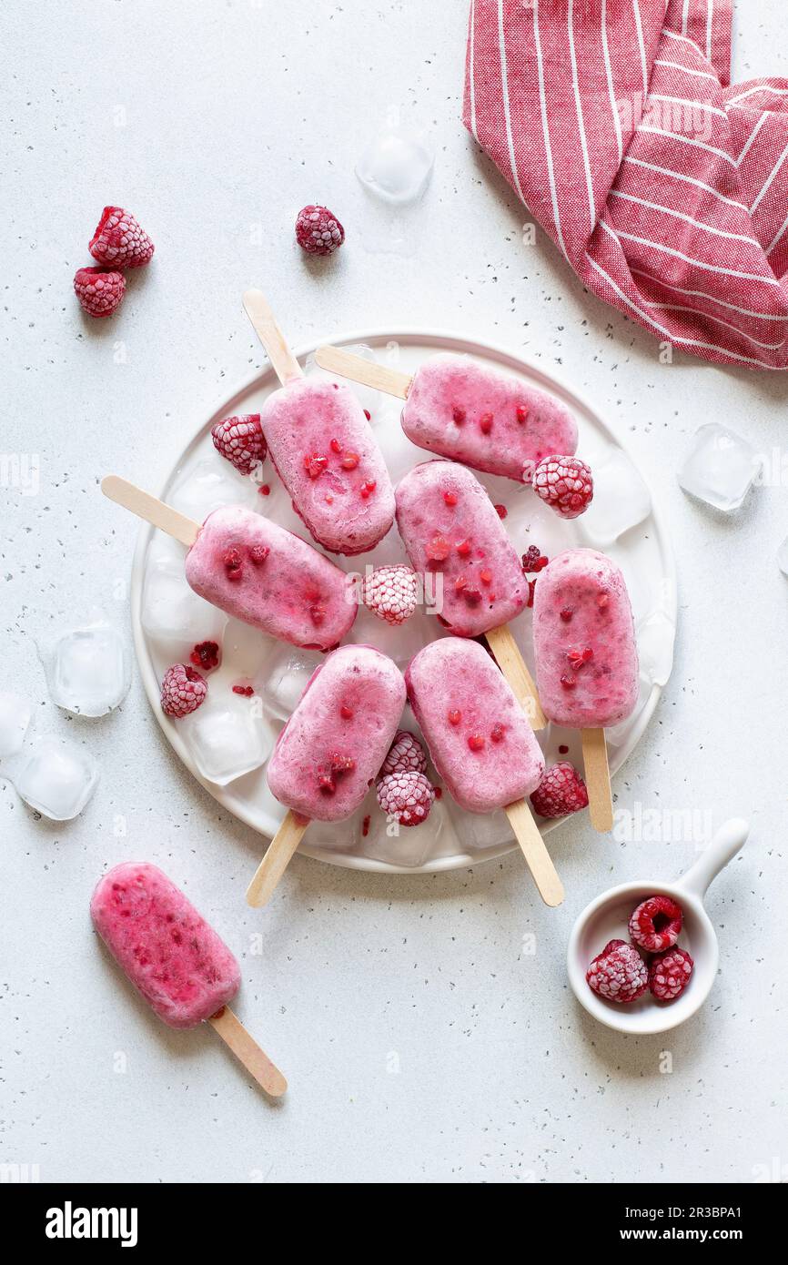 Raspberry ice cream on sticks Stock Photo - Alamy