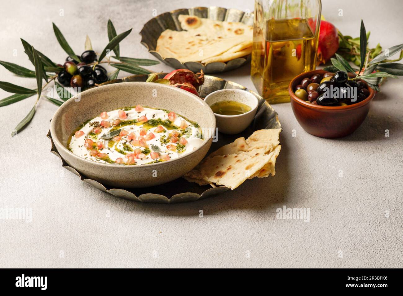 Iranian labneh with taftan bread and pomegranate Stock Photo - Alamy