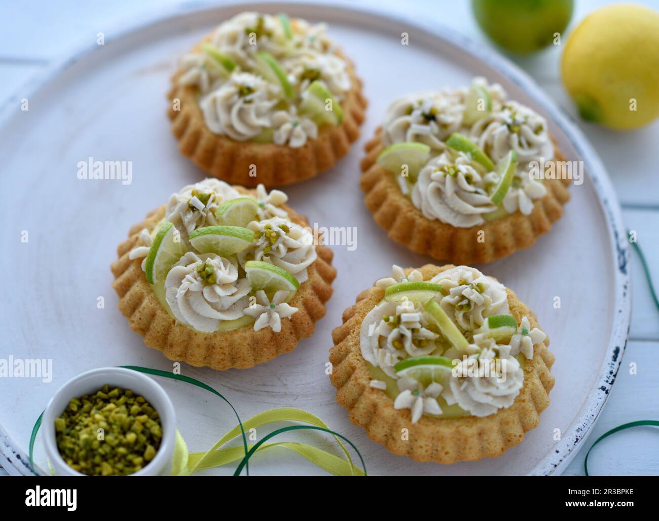 Vegan lime-lemon tartlet with a sponge cake base Stock Photo - Alamy