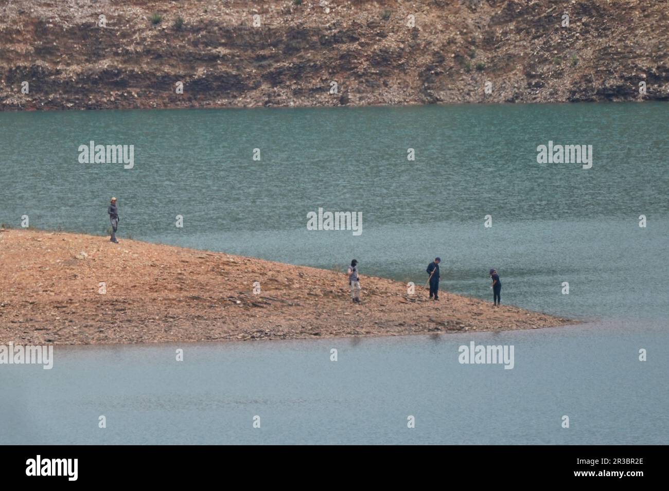 Personnel at Barragem do Arade reservoir, in the Algave, Portugal, as ...
