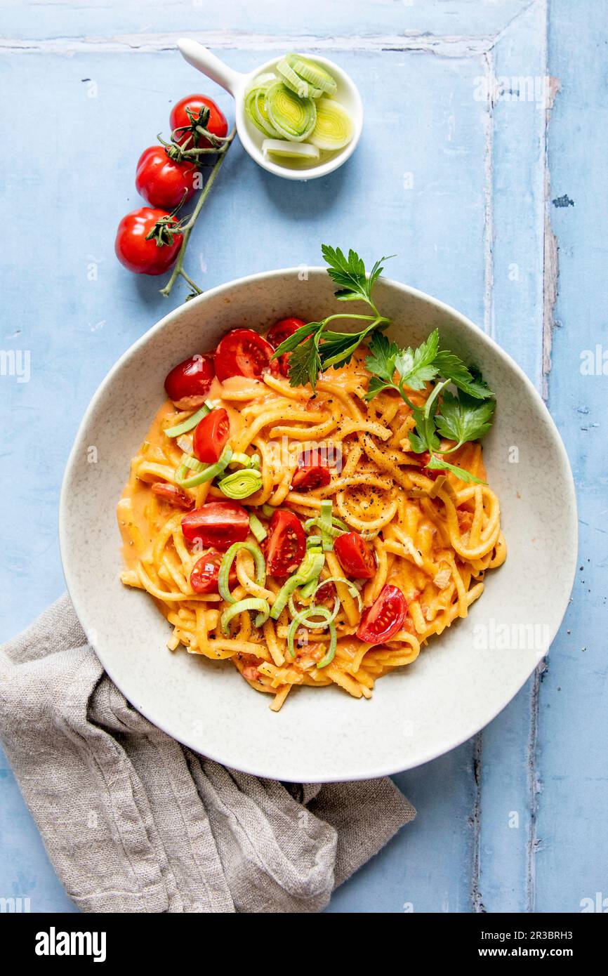 One-pot spaetzle with tomatoes Stock Photo - Alamy