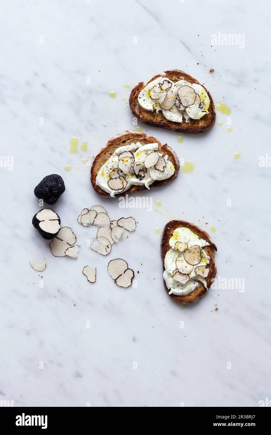 Toasted bread with mozzarella and truffle Stock Photo - Alamy