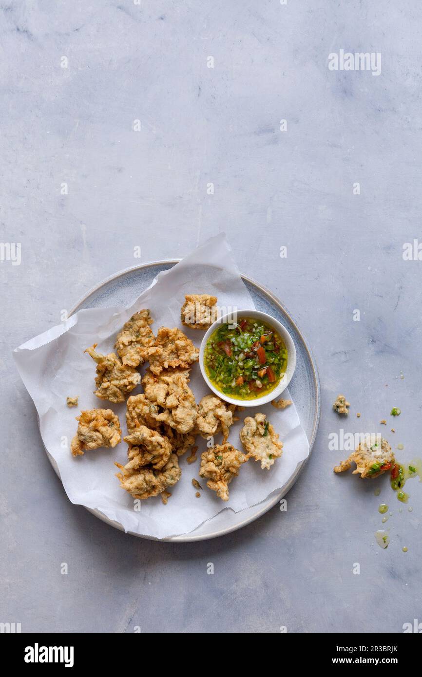 Fried cod nuggets with dip Stock Photo - Alamy