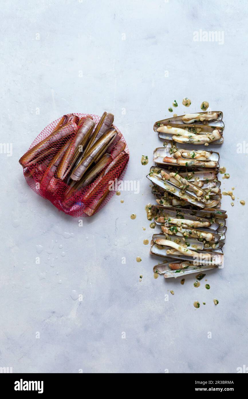 Grilled razor clams Stock Photo - Alamy