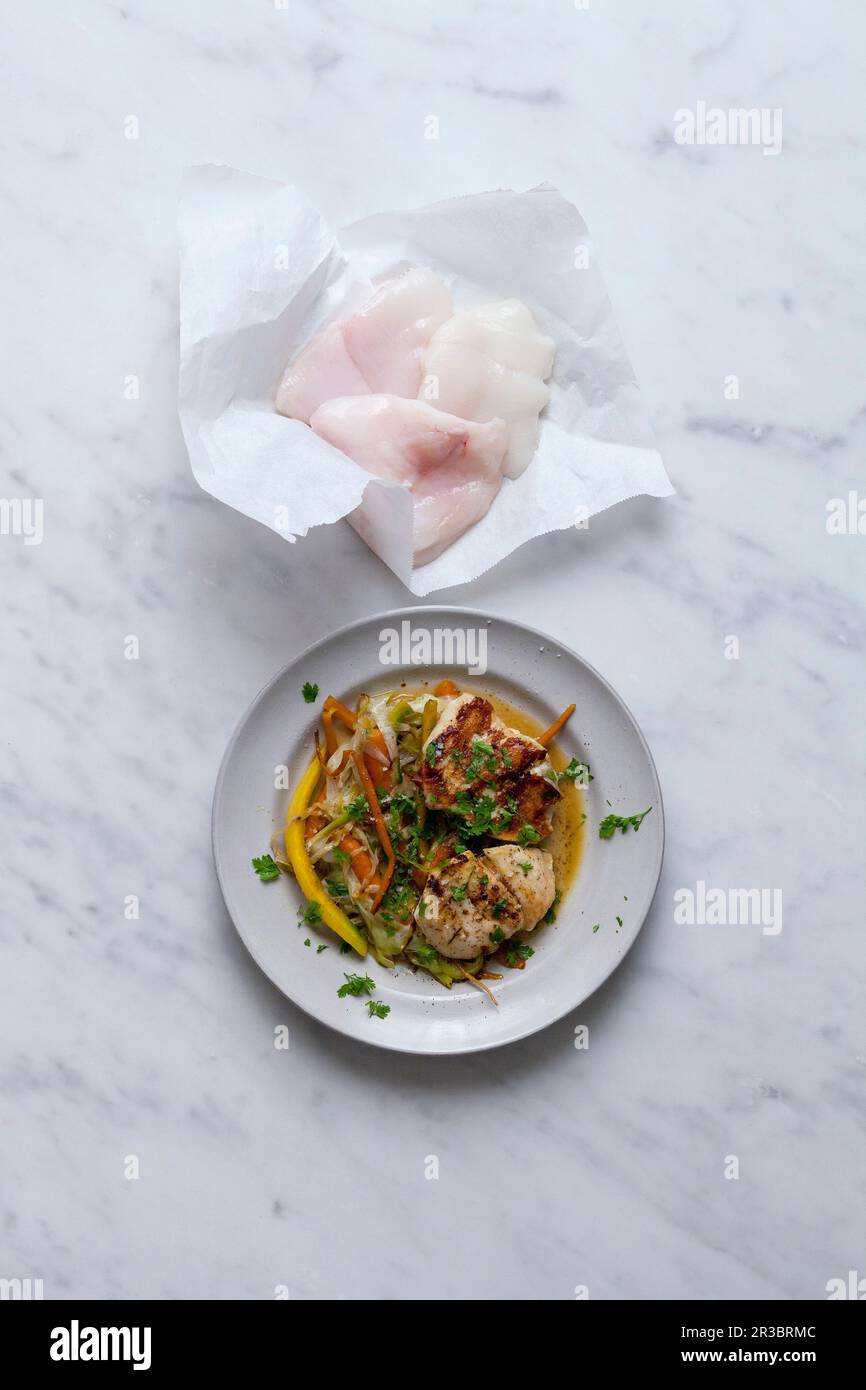 Pan fried monkfish cheeks Stock Photo - Alamy