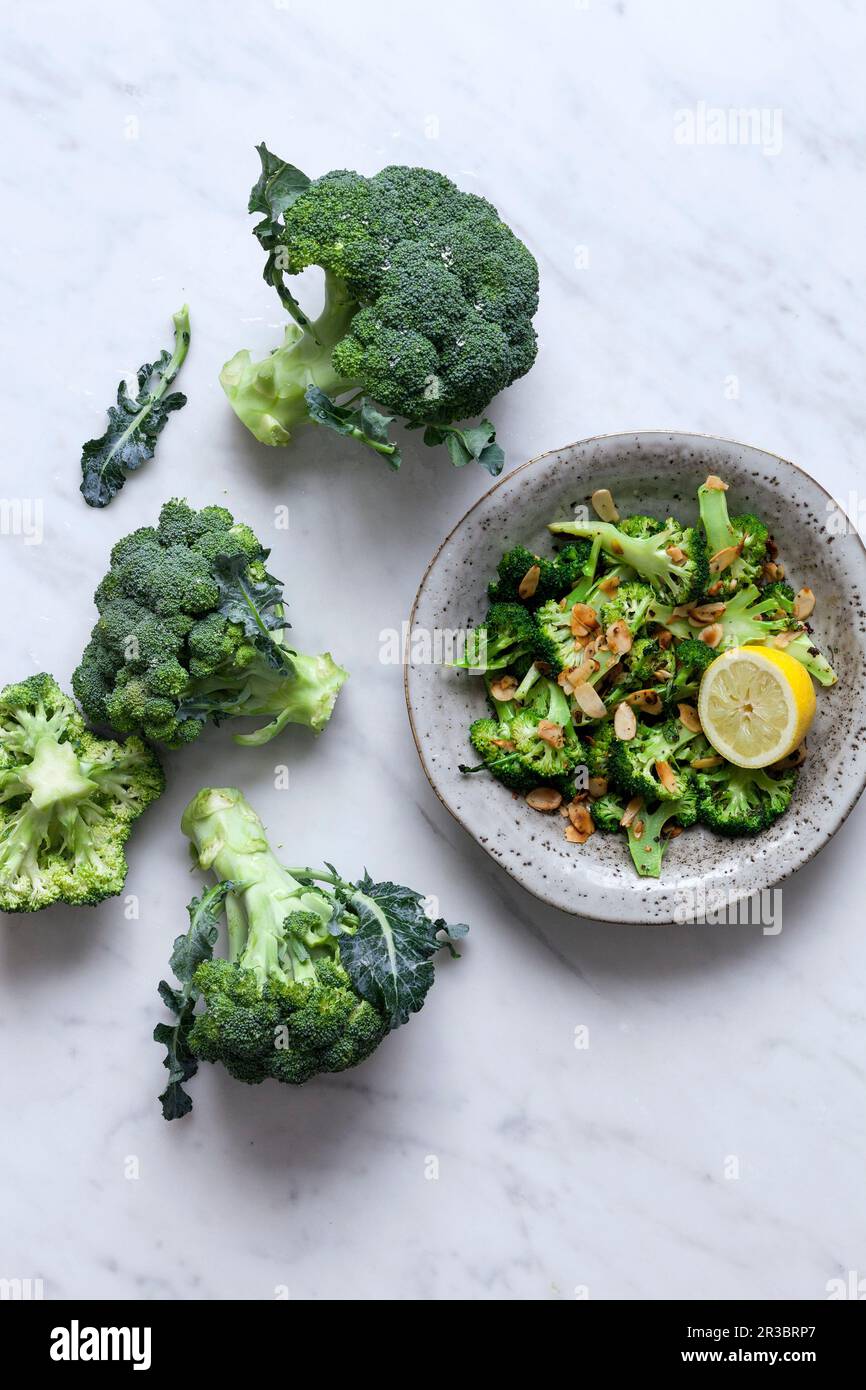 Fried broccoli with almonds Stock Photo - Alamy