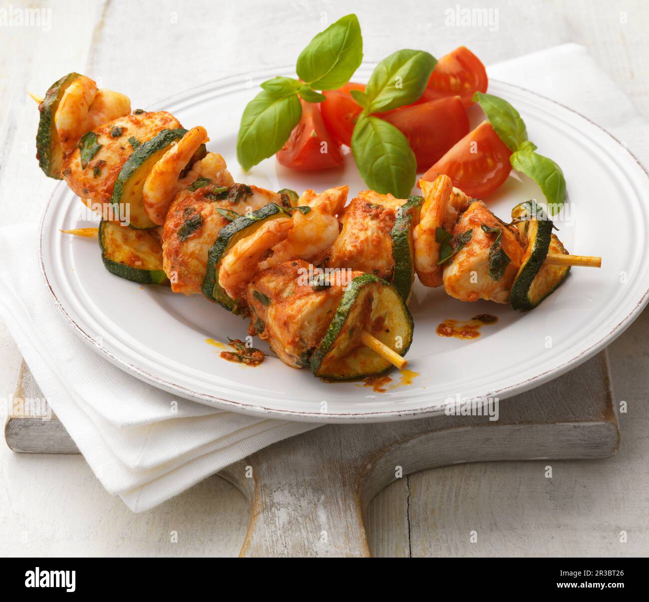 Chicken, prawn and vegetable kebab Stock Photo - Alamy